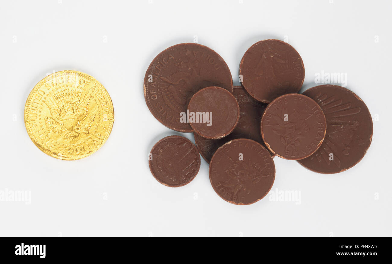 Chocolate coins, in and out of gold wrappers Stock Photo - Alamy