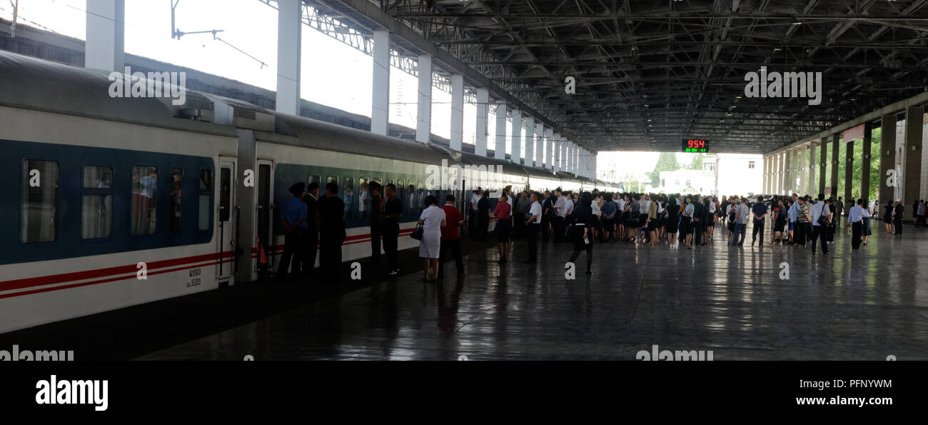 Crowds of tourists on the platform at Pyongyang railway station ...