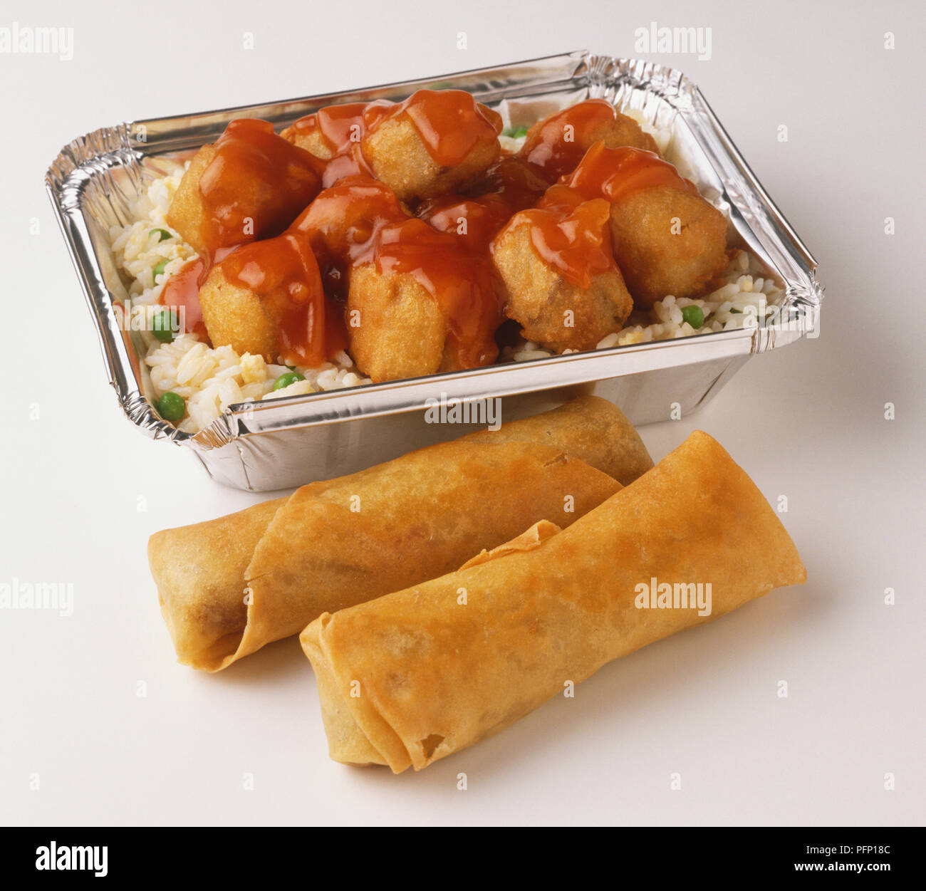 Sweet and Sour Pork with Fried Rice and Spring Rolls Stock Photo - Alamy