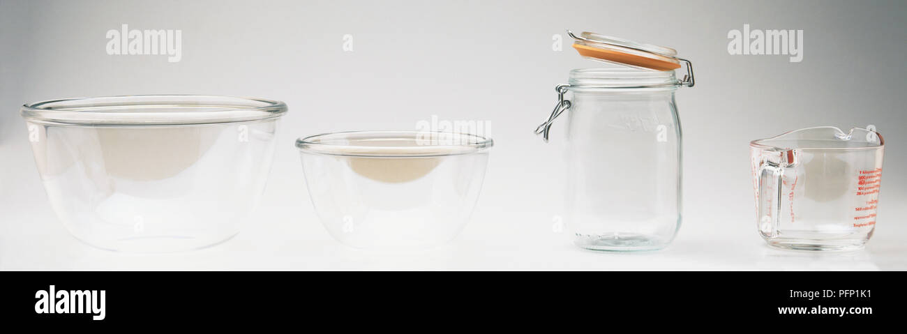 Kitchen utensils made from glass, including mixing bowls, measuring jug ...