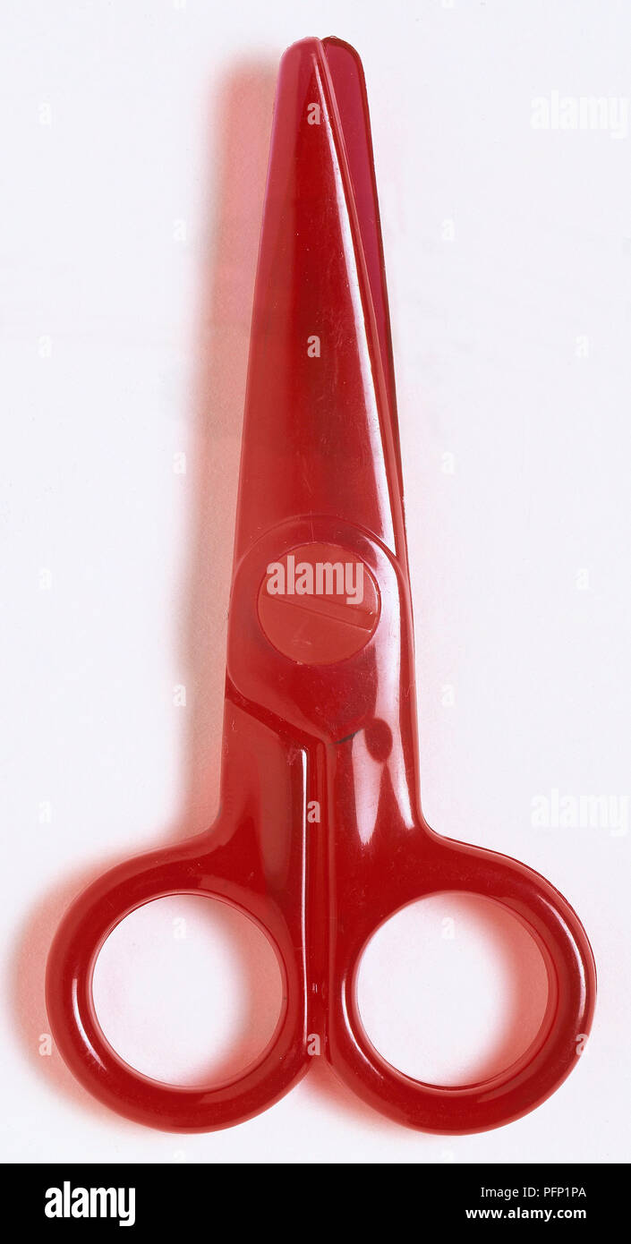 Red plastic scissors, view from above Stock Photo - Alamy
