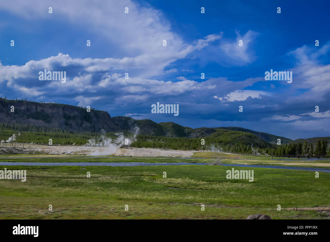 Amazing landscape of river crossing close to small geysers, hot springs ...