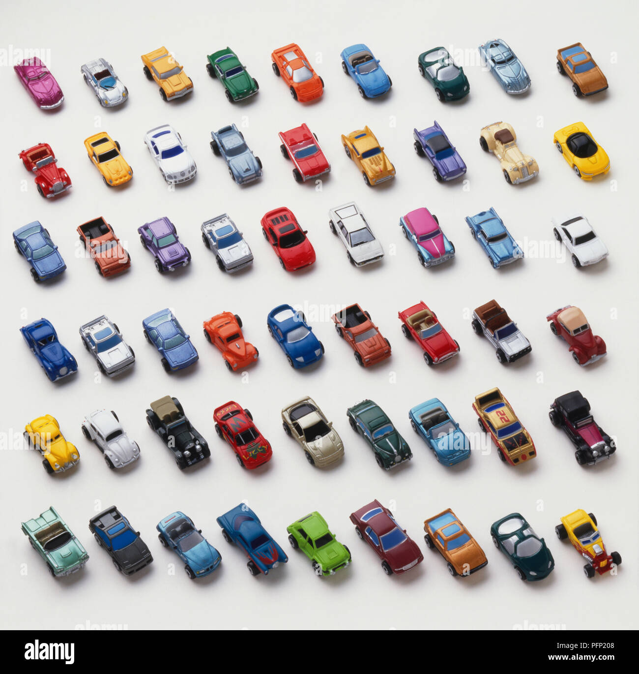 Assorted colourful toy cars laid out in rows, view from above Stock ...