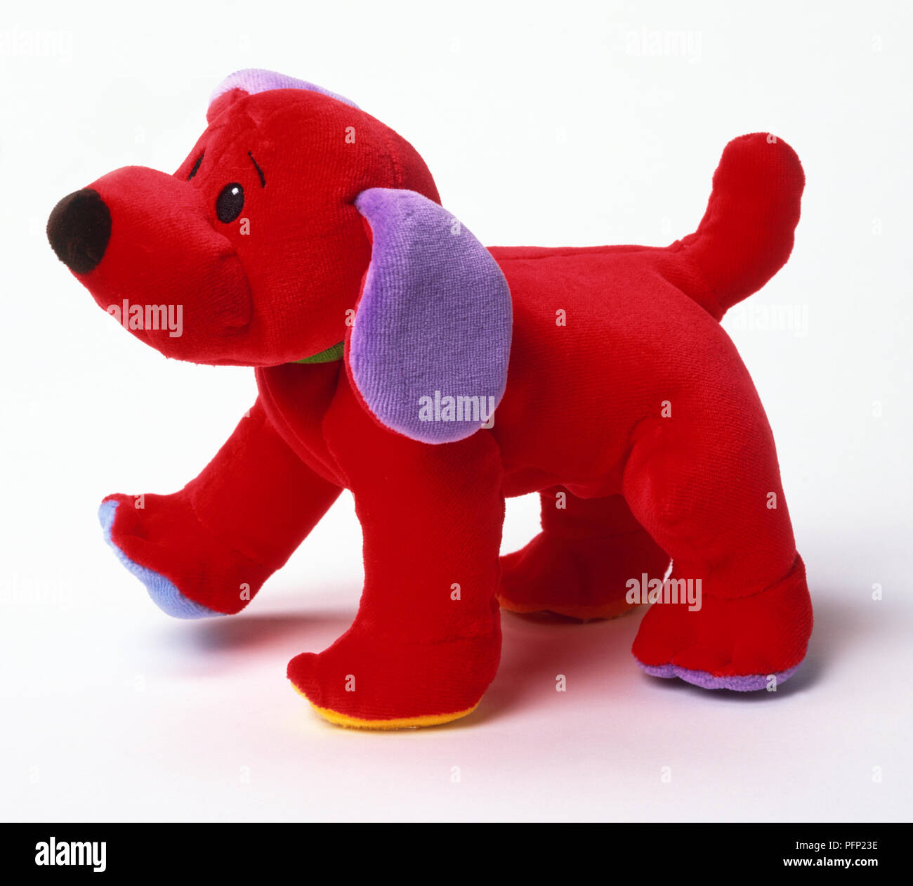 Red and purple toy dog, side view Stock Photo - Alamy