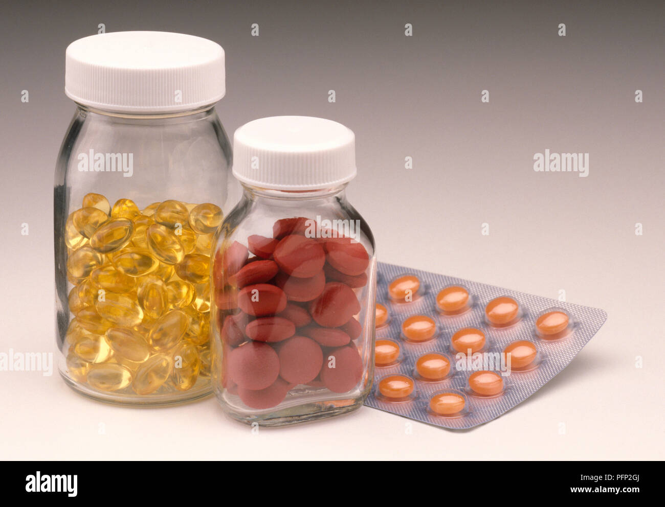 Vitamin supplements in glass bottles and blister pack Stock Photo - Alamy