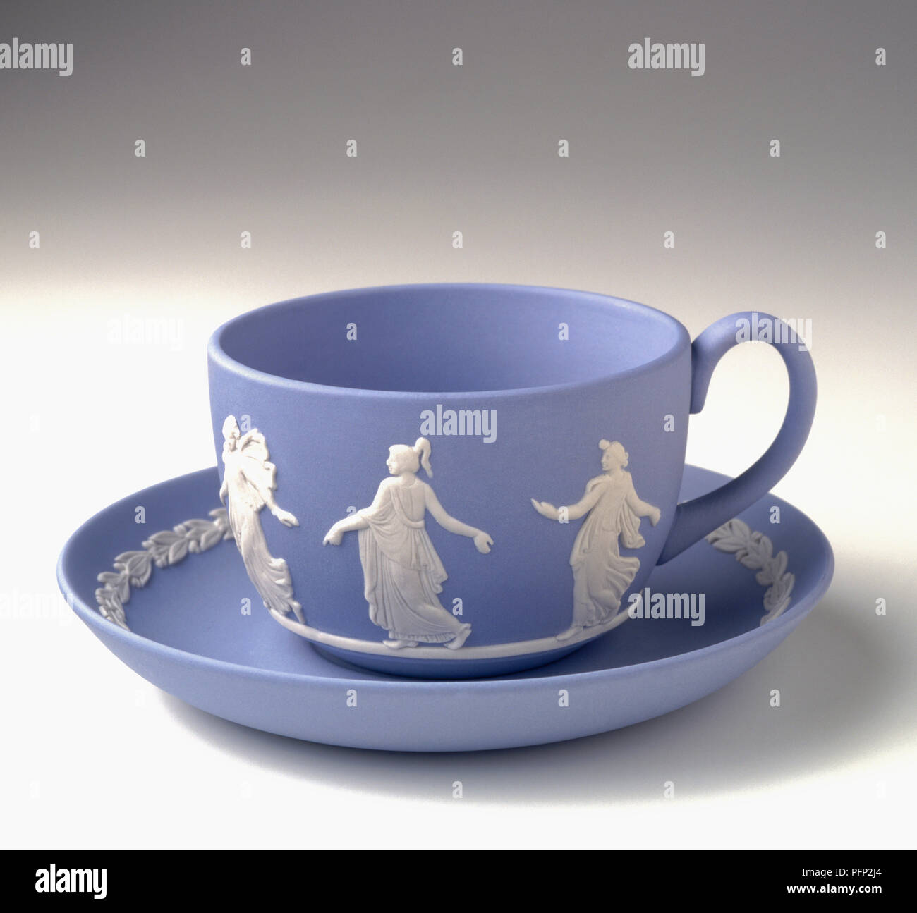 Cup and saucer in cameo design showing Greek classical figures Stock ...