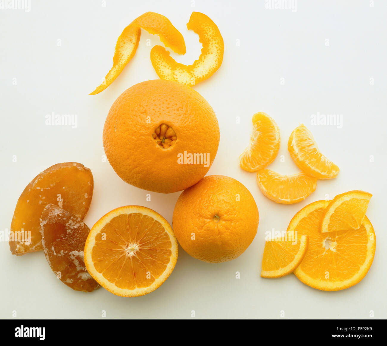 Above view of Oranges slices, two wedge-shaped slices, peel, and three ...