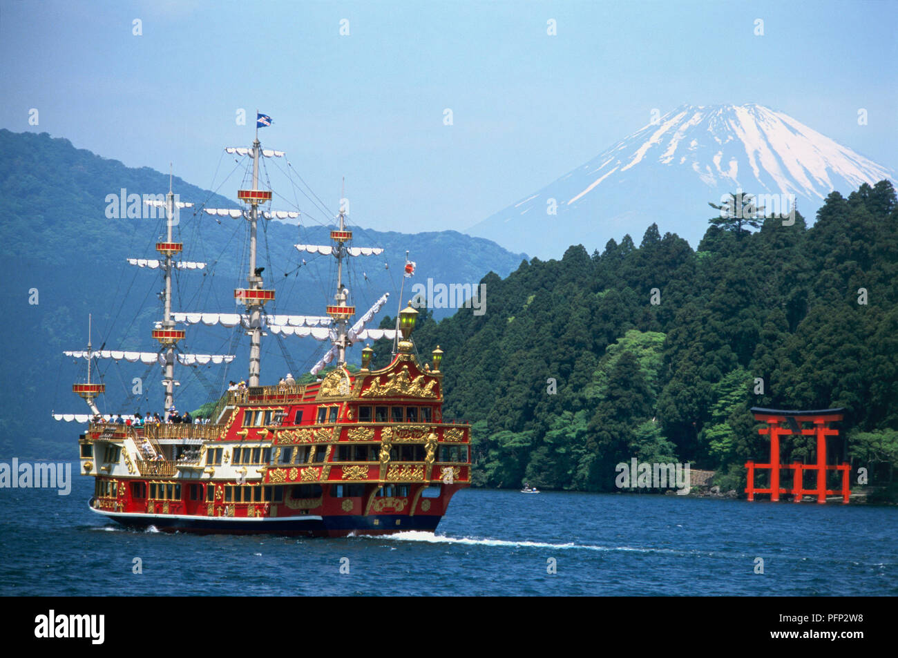 Japan, Central Honshu, motorised sailing ship on Lake Ashi with snow ...