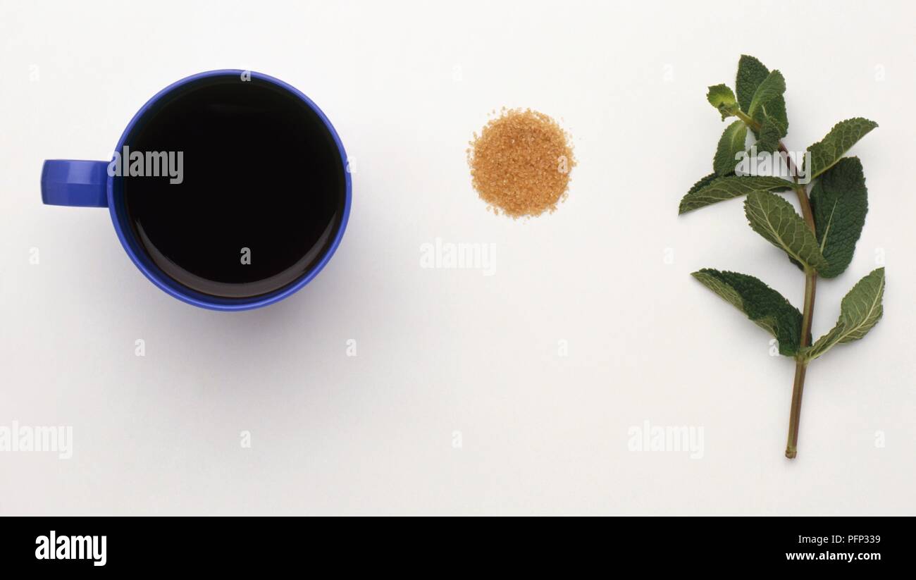 Mint leaves, brown sugar and cup of mint tea Stock Photo - Alamy