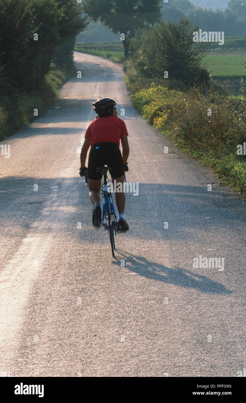 Lone female cyclist hi-res stock photography and images - Alamy