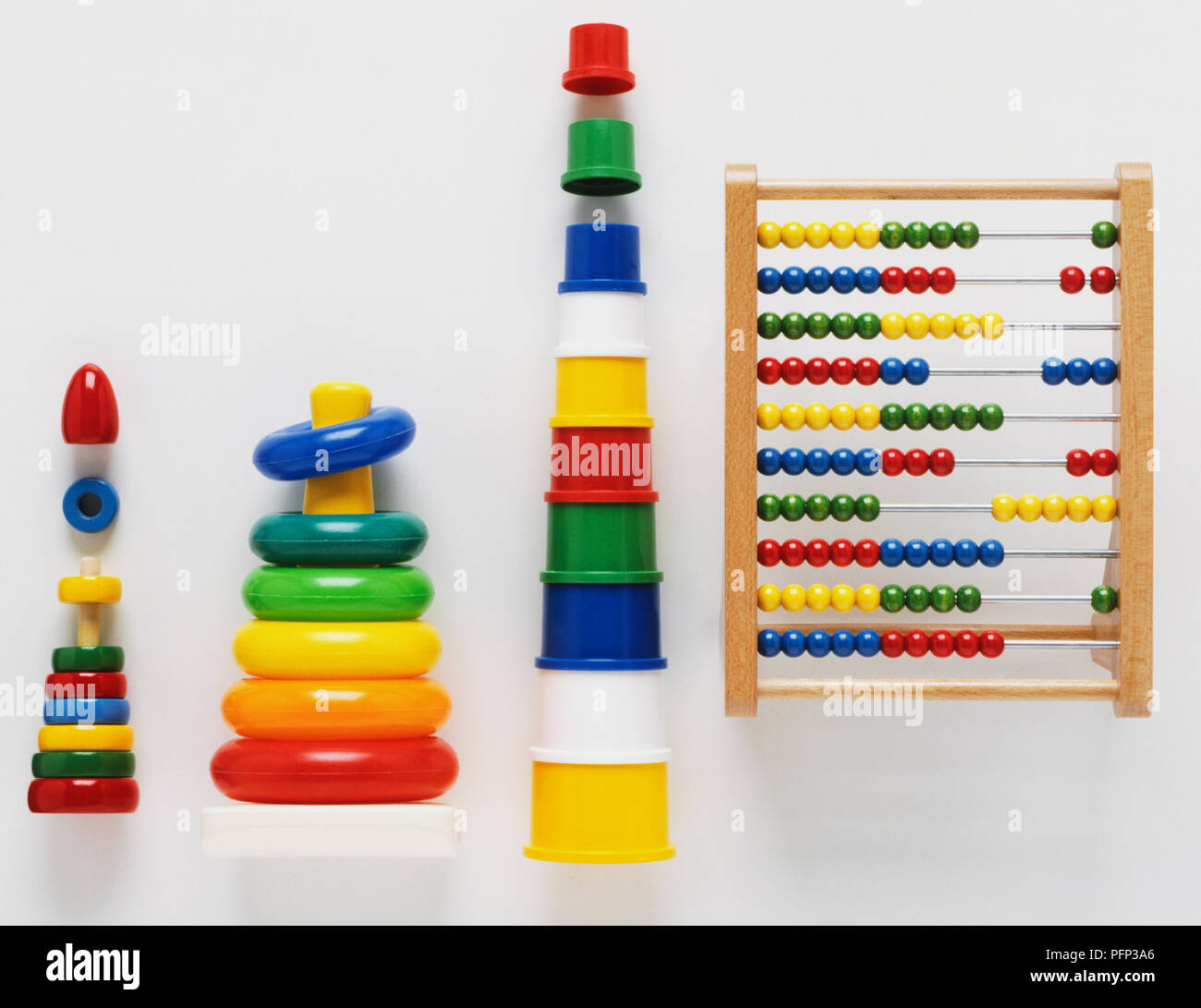An abacus, next to plastic sort and stack toys Stock Photo - Alamy