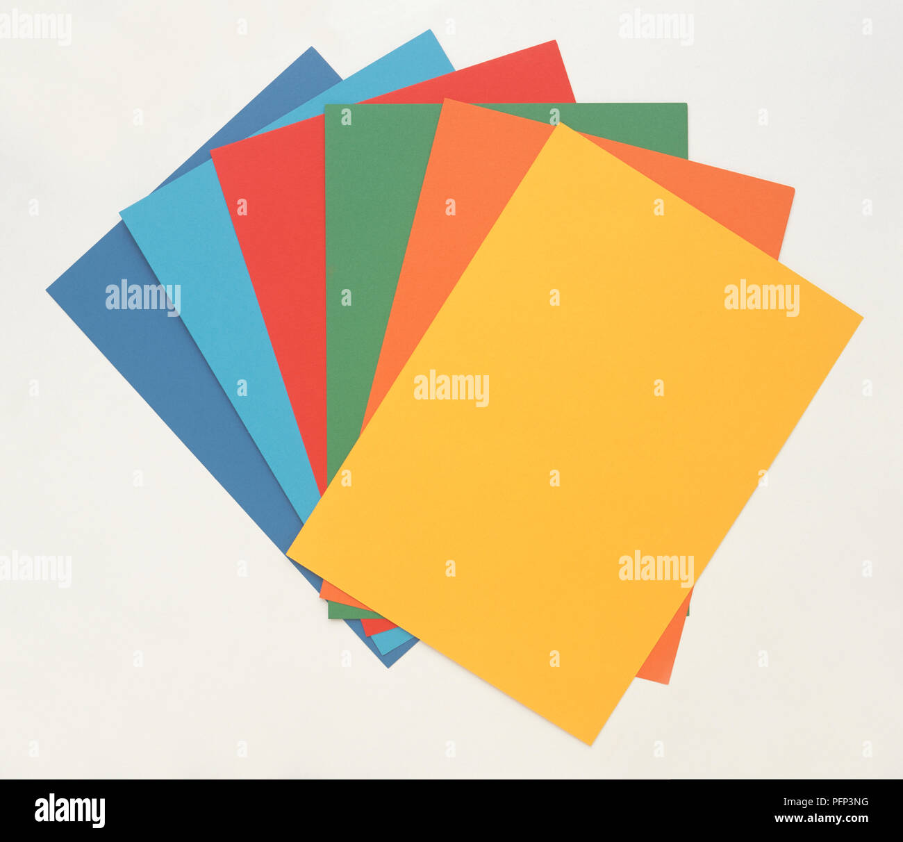 Coloured card, yellow, orange, green, red and blue Stock Photo - Alamy