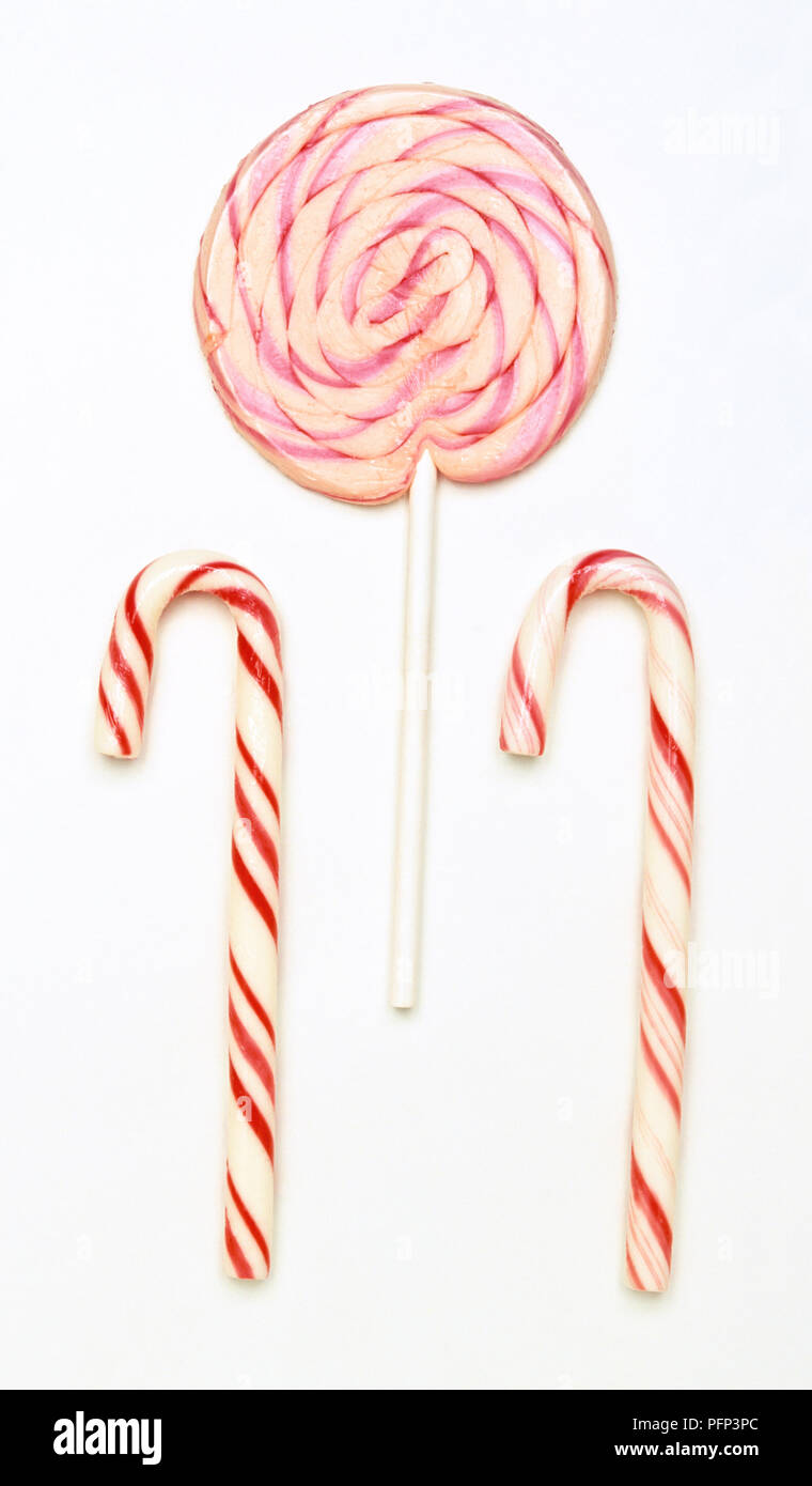 Two candy canes and a round lolly Stock Photo - Alamy