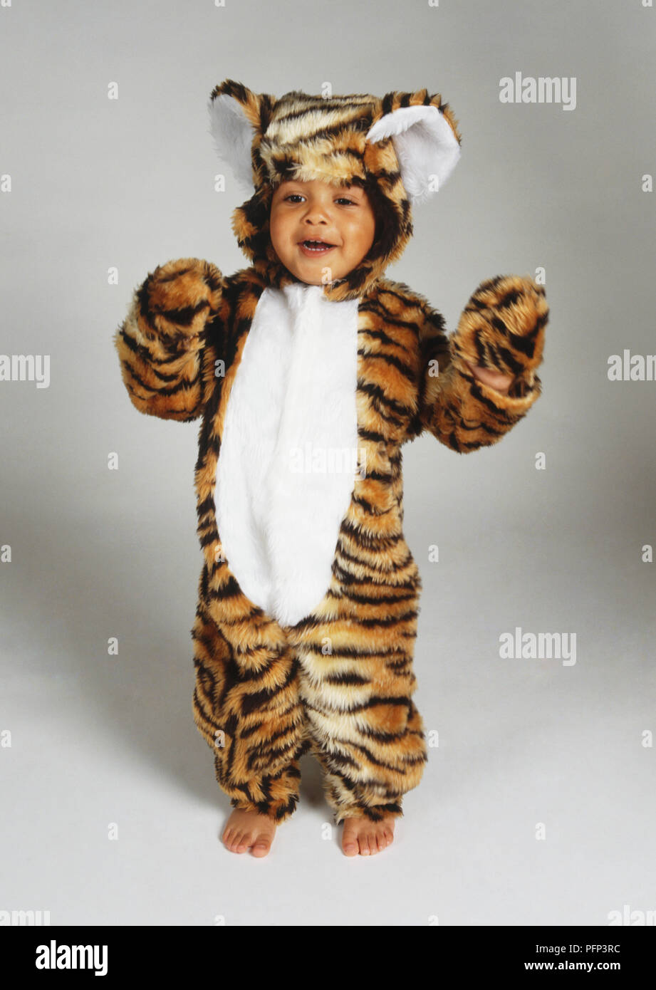 Child dressed in a tiger costume Stock Photo - Alamy
