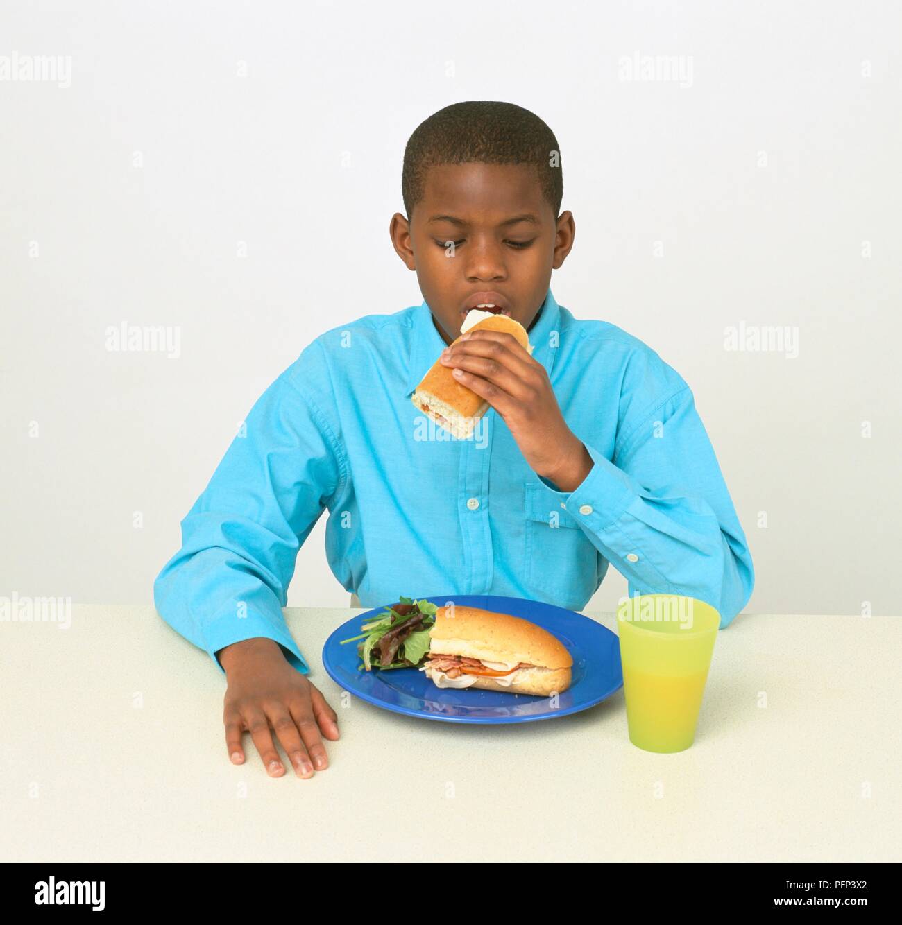 Boy eating meat roll hi-res stock photography and images - Alamy