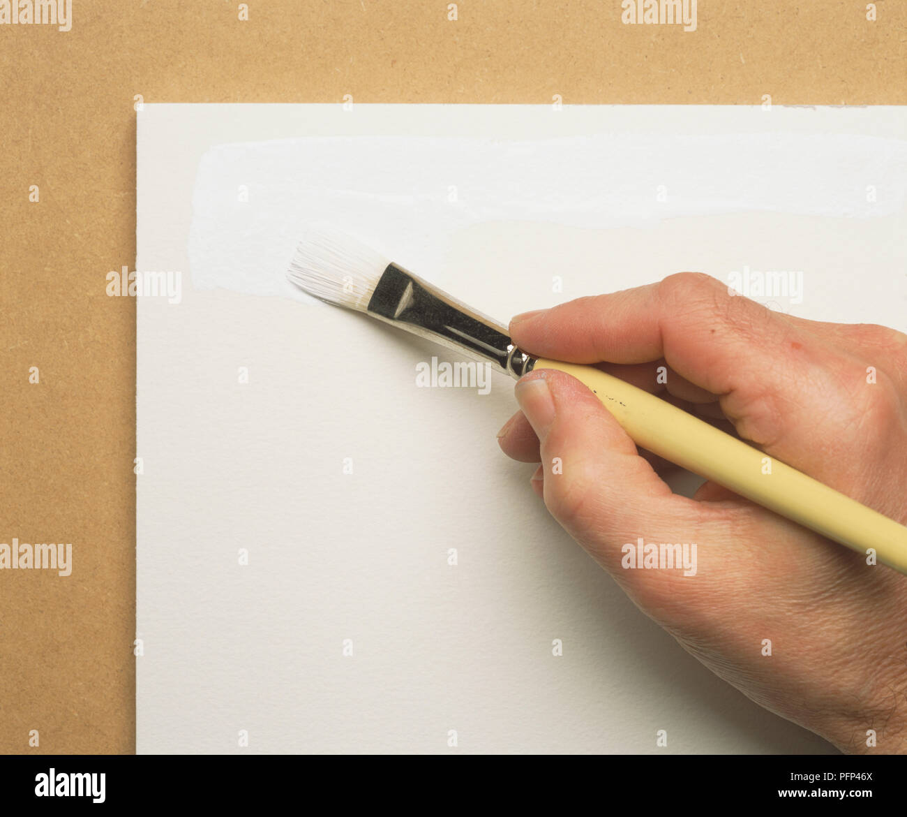 Preparing paper for silverpoint work using brush and thin layer of ...