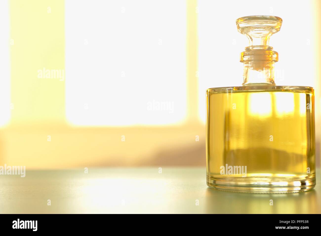Bottle of perfume on dressing table Stock Photo - Alamy