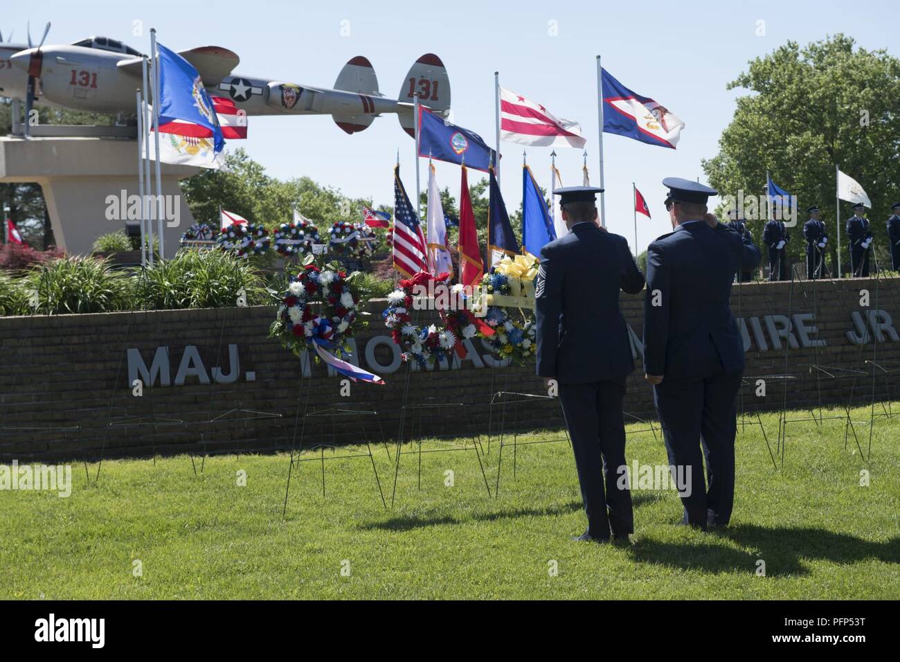 Two U.S. Air Force Airmen salute a wreath during the Parade of Wreaths ...