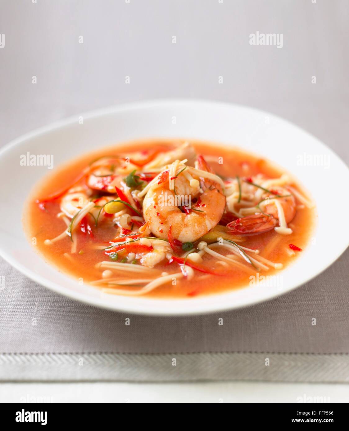 Thai prawn soup served in white bowl Stock Photo - Alamy