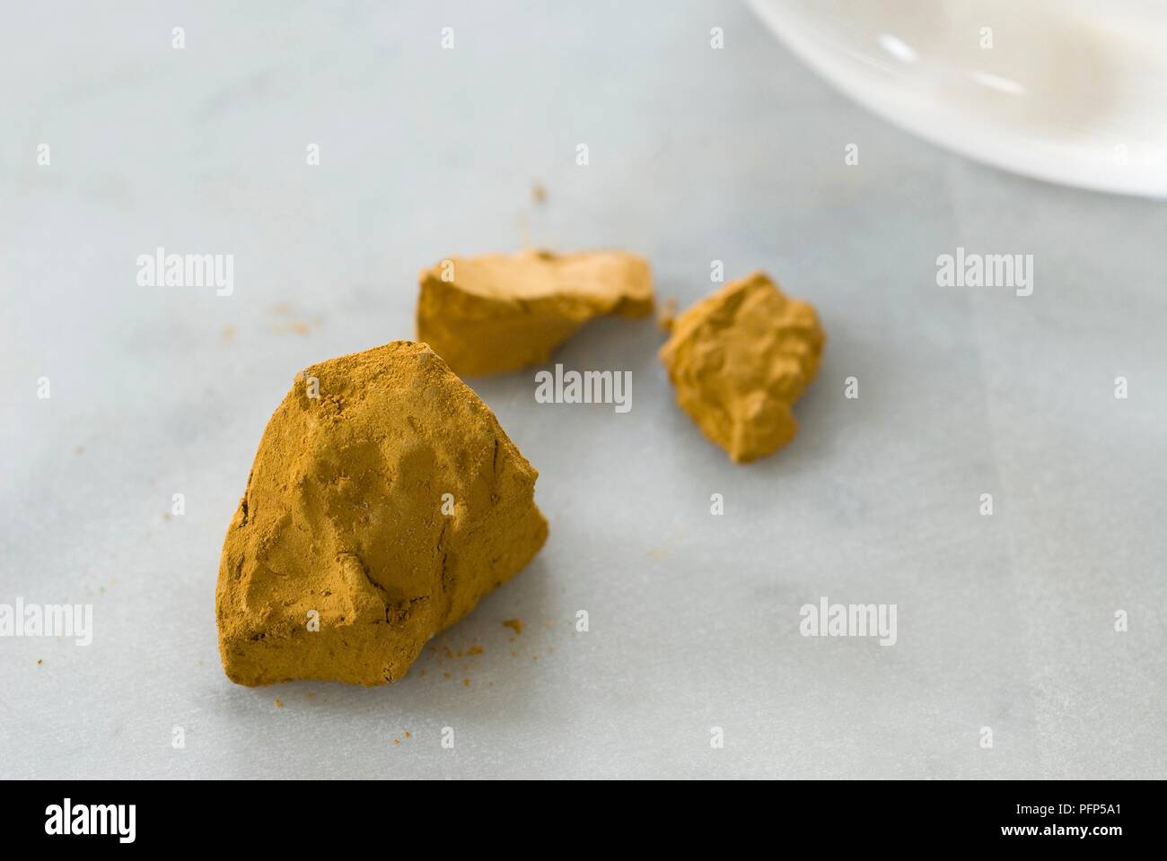 Lumps of yellow ochre pigment Stock Photo - Alamy