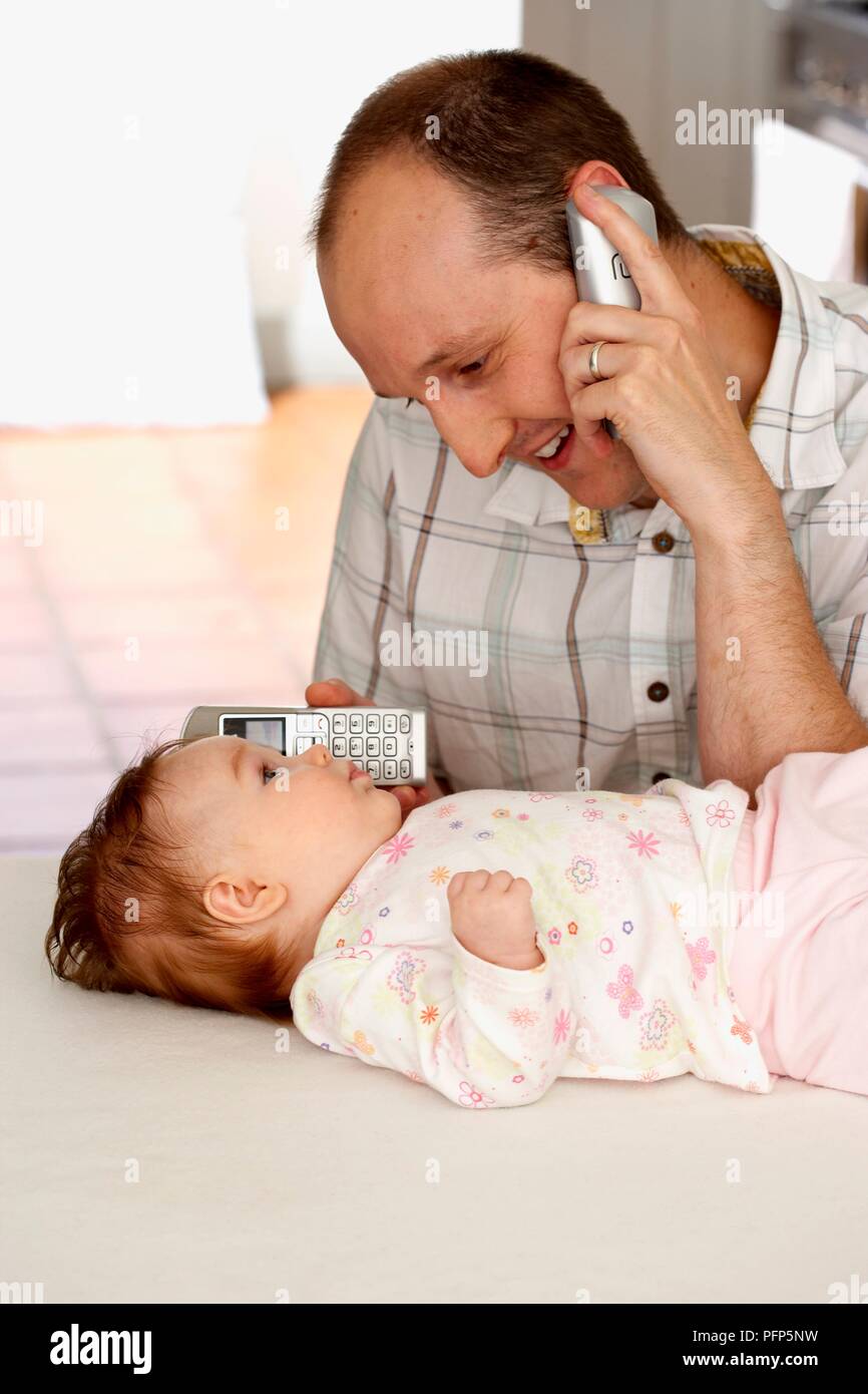 Man, pretending baby hi-res stock photography and images - Alamy