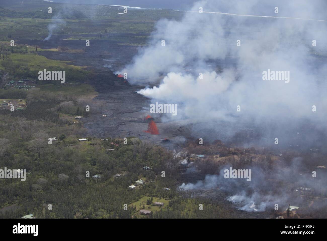 A stream of lava tears through residential areas in the Leilani ...