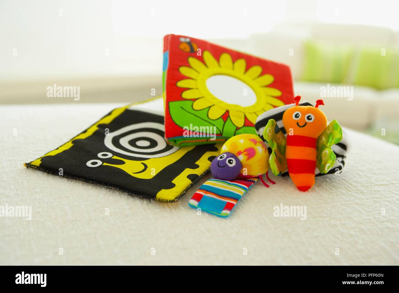Collection of soft books and toys for babies Stock Photo - Alamy