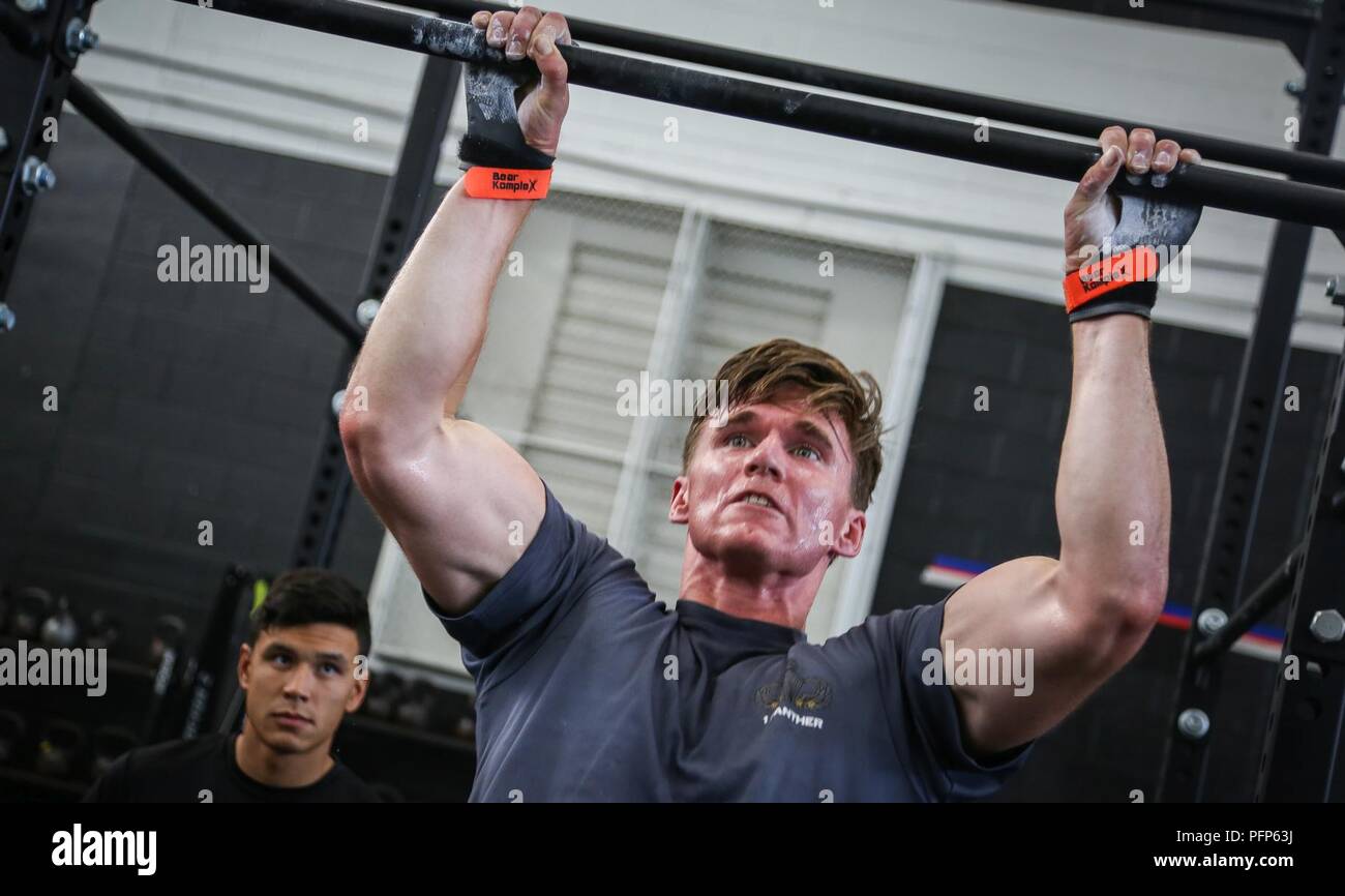 A U.S. Paratrooper assigned to the 82nd Airborne Division, attemps pull ...