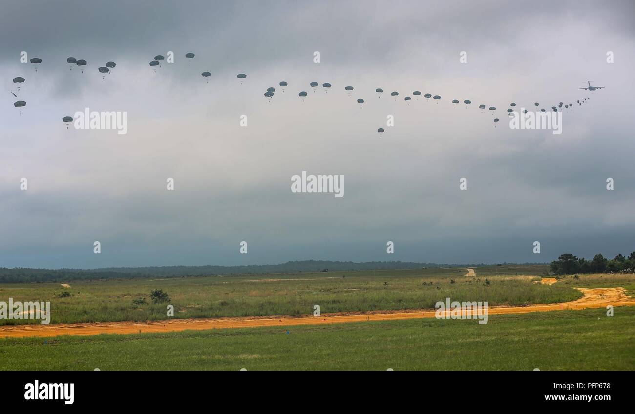 U.S. Paratroopers jump from a CH47 Chinook at Sicily Drop Zone during ...