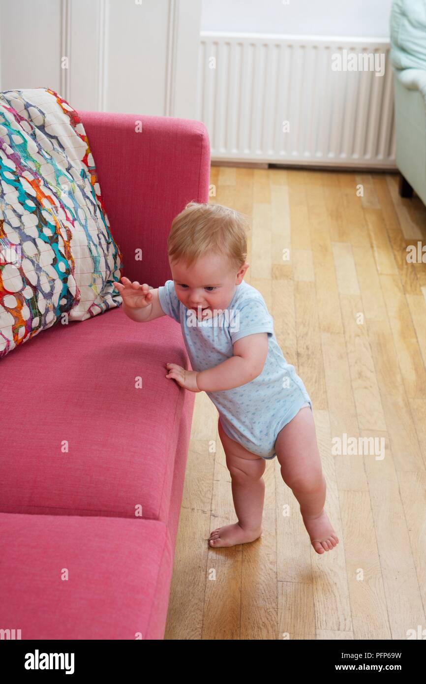 Baby walking furniture hi-res stock photography and images - Alamy