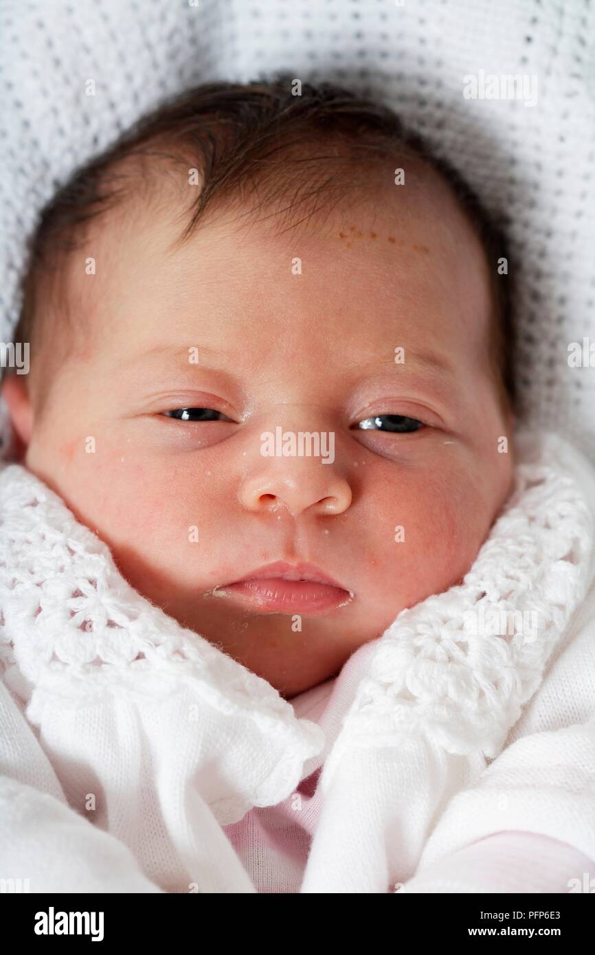 Baby squinting hi-res stock photography and images - Alamy