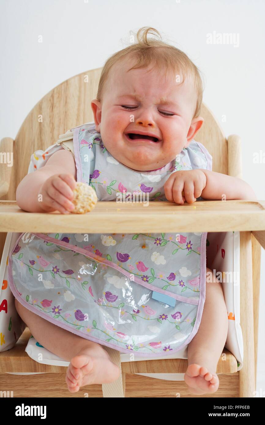 Baby crying in high chair hi-res stock photography and images - Alamy