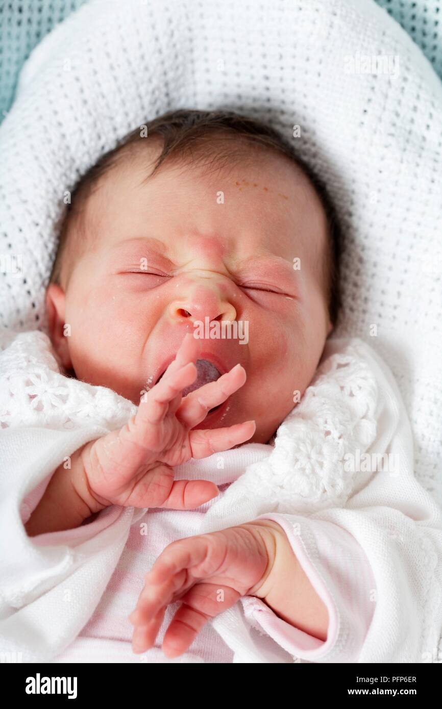 Baby girl yawning, close-up, front view Stock Photo - Alamy