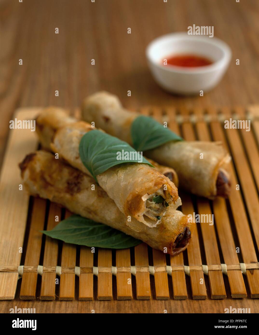 Cha Gio, Vietnamese chicken spring rolls with fresh mint leaves, and ...