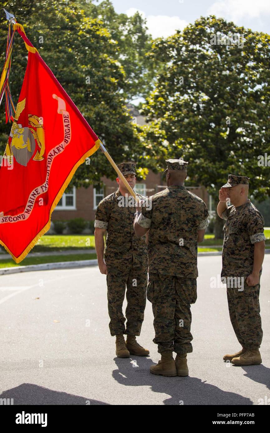 U.S Marine Corps Brig. Gen. Michael E. Langley passes the colors to Col ...