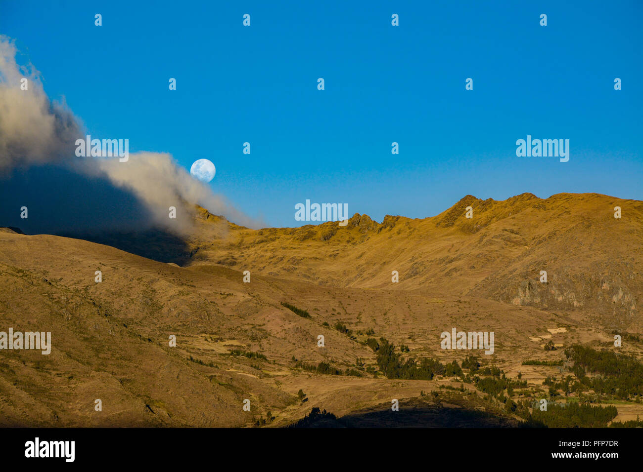 The moon rising behing the Andes Mountains Stock Photo - Alamy