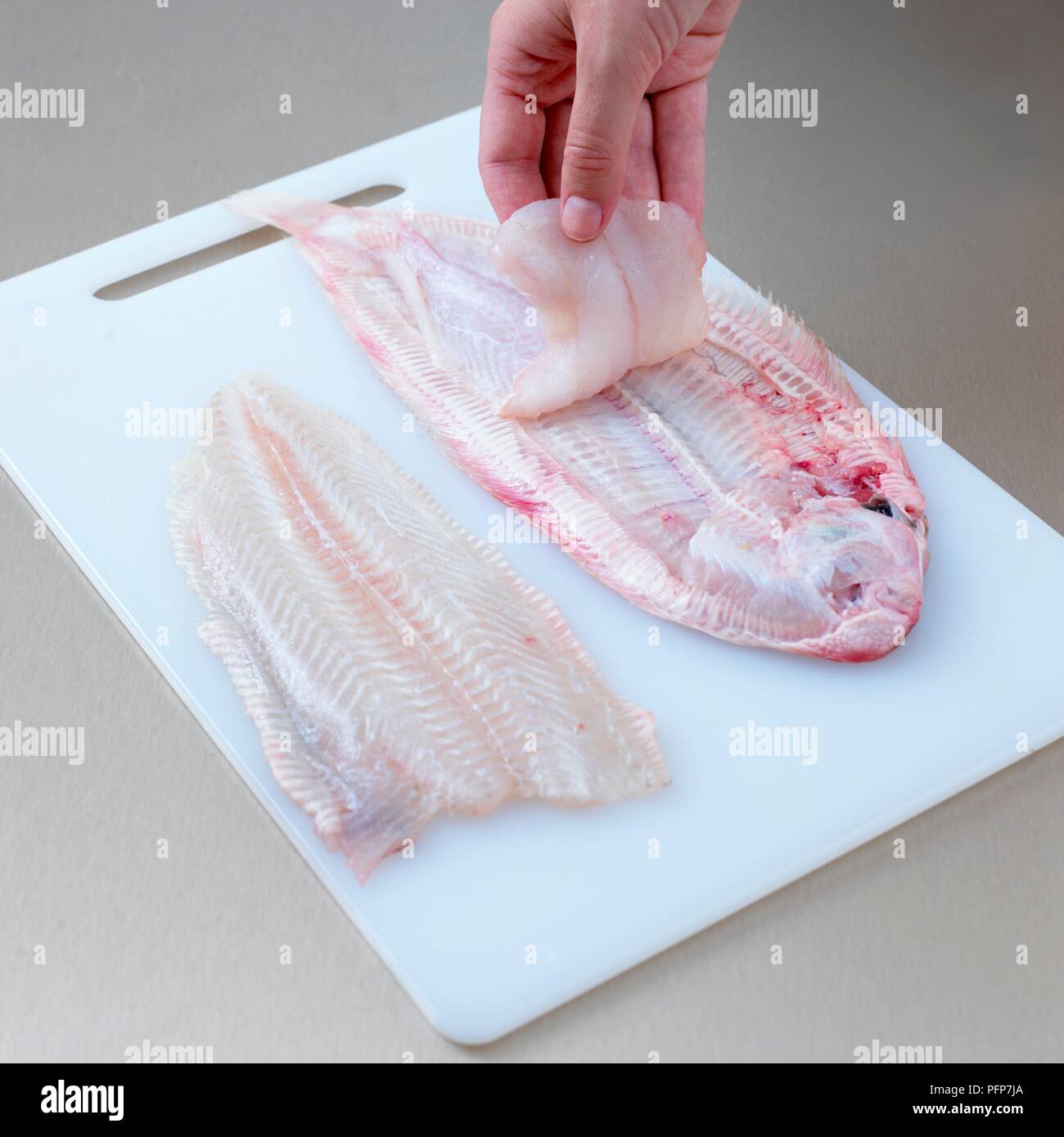 Women gutting fish hi-res stock photography and images - Alamy