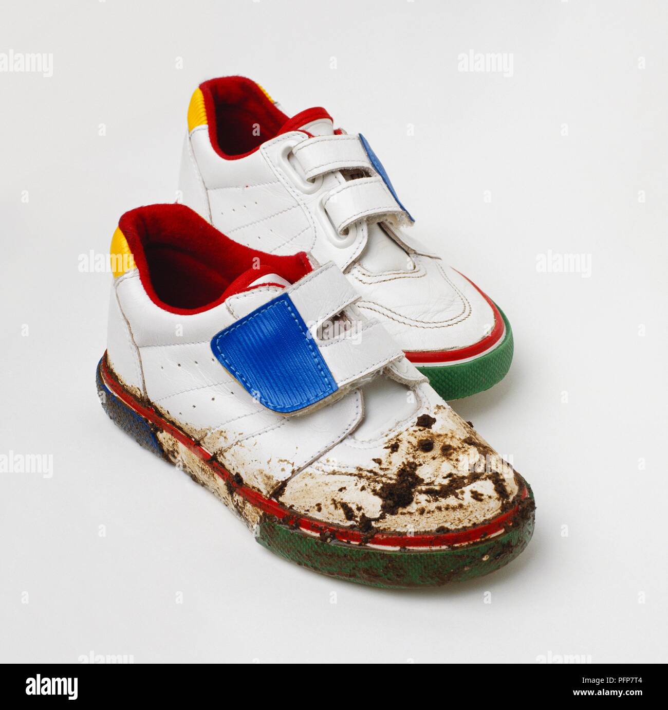 Pair of muddy and clean trainers Stock Photo - Alamy