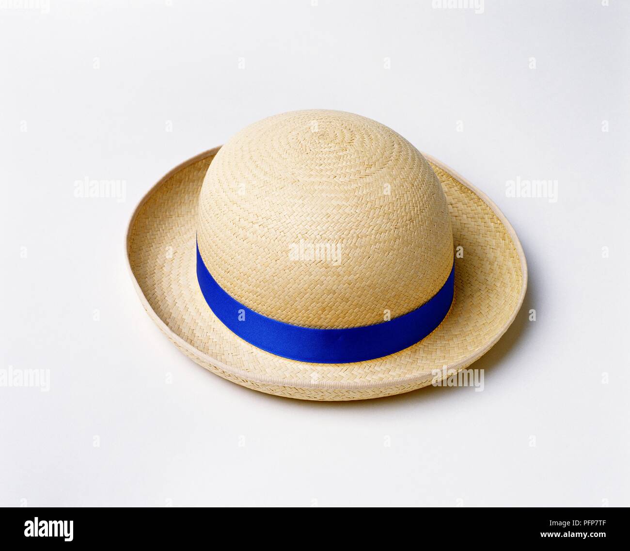 Girls straw boater with blue ribbon Stock Photo - Alamy