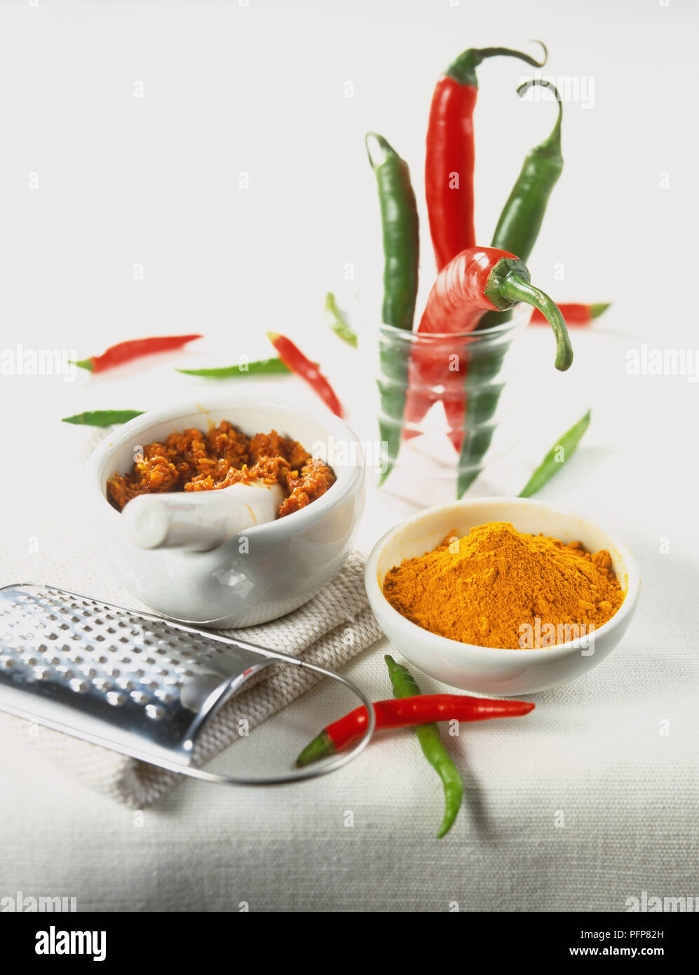 Curcuma longa, ground Turmeric in small ceramic bowl, ground spices in ...
