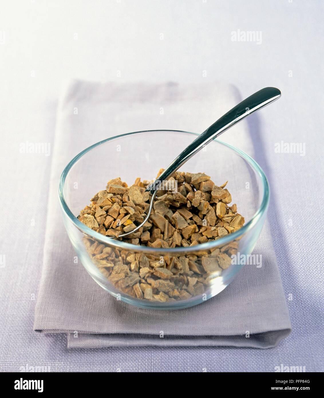 Curcuma zedoaria (Zedoary), dried rhizome pieces in glass bowl, with ...
