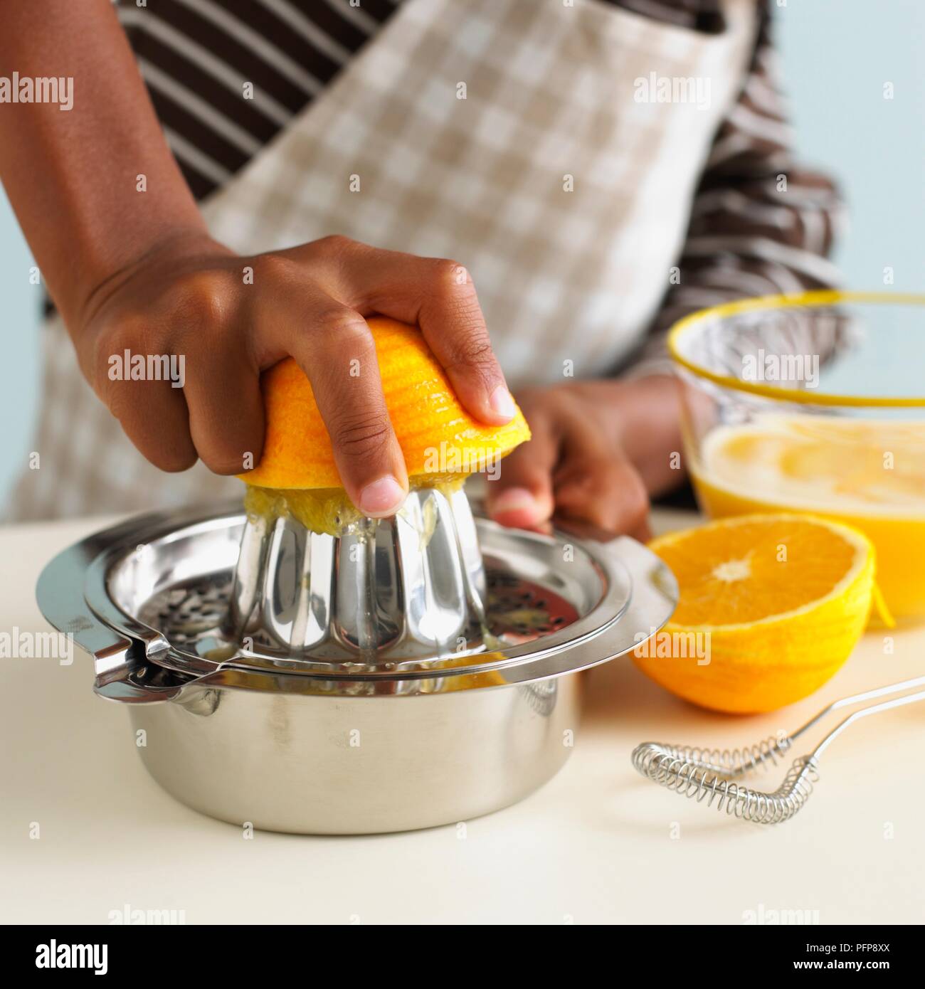 Child squeezing orange juice hi-res stock photography and images - Alamy
