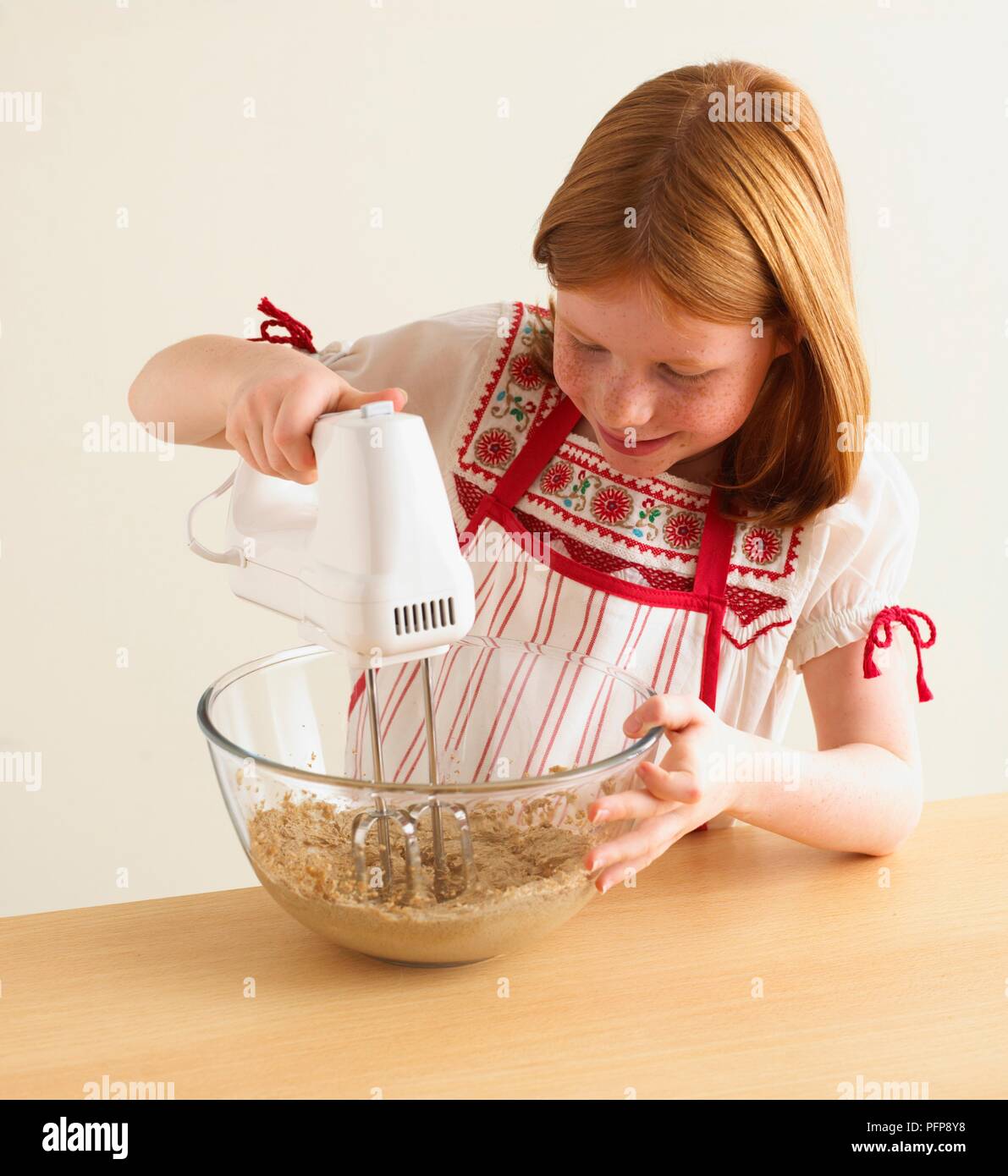 Person using electric food mixer hi-res stock photography and images ...