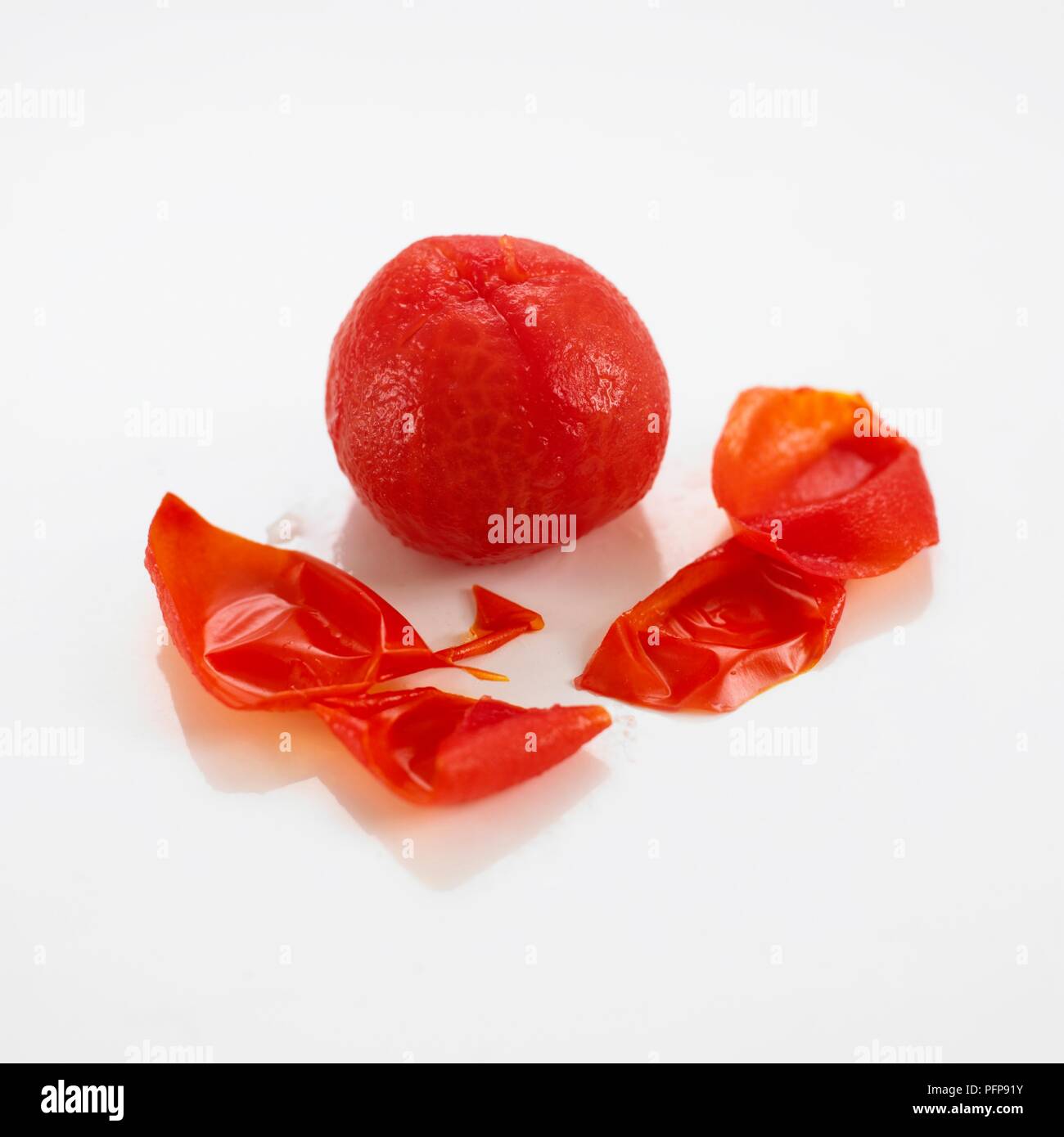 Blanched tomato with peel removed Stock Photo - Alamy