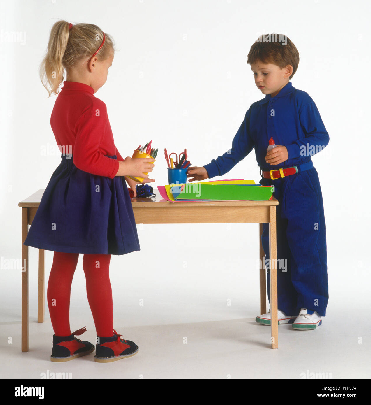 Boy picking up pencil hi-res stock photography and images - Alamy