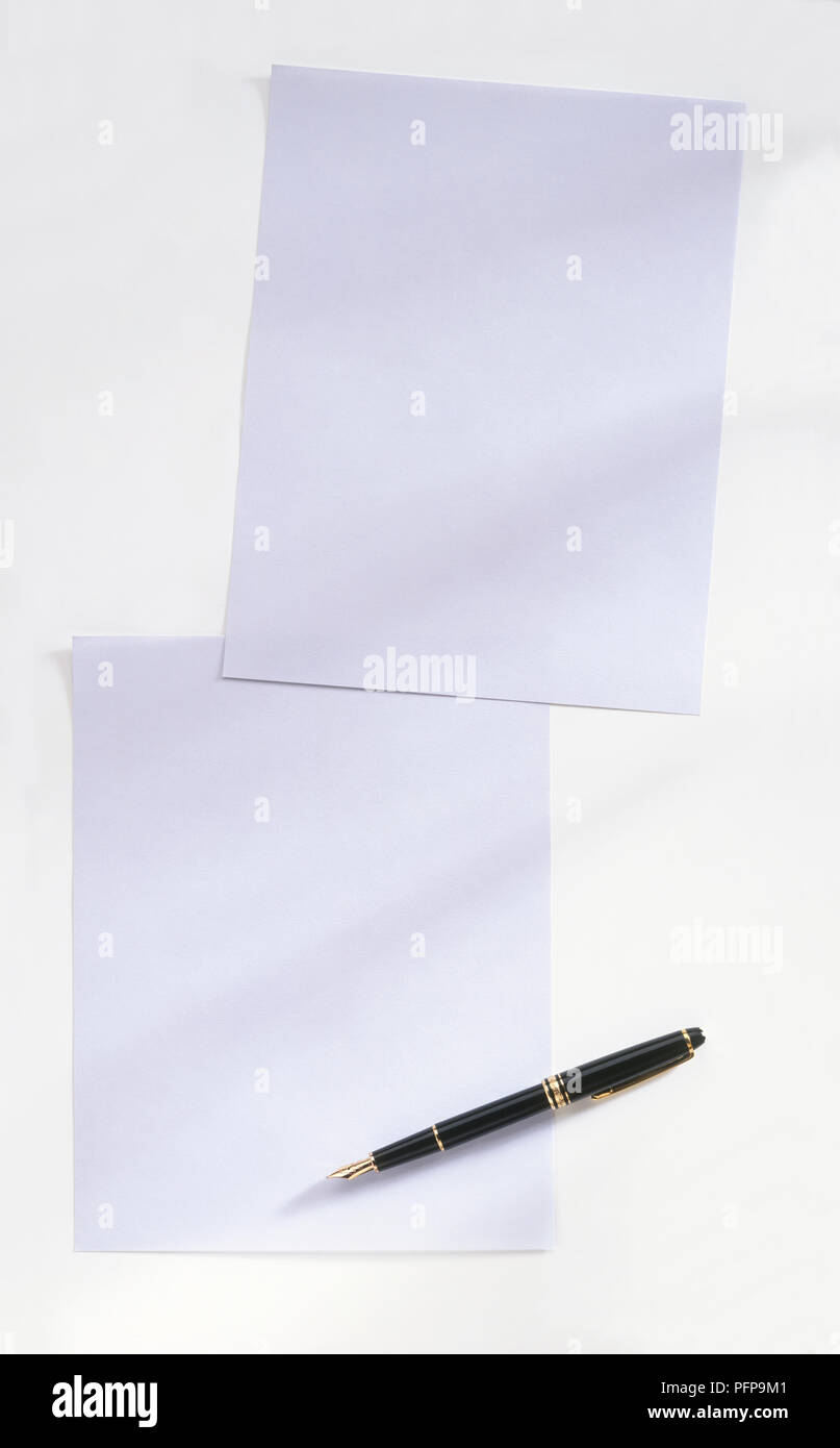 Two pieces of white paper, and fountain pen Stock Photo - Alamy
