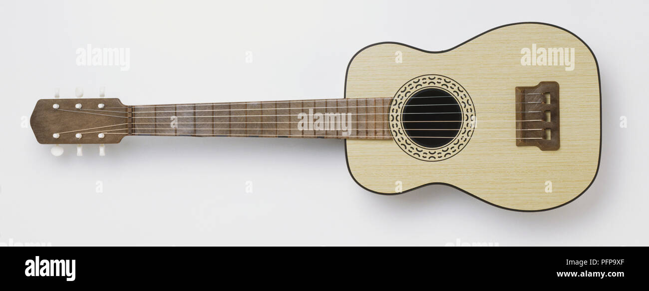 Acoustic guitar, full length side view Stock Photo - Alamy