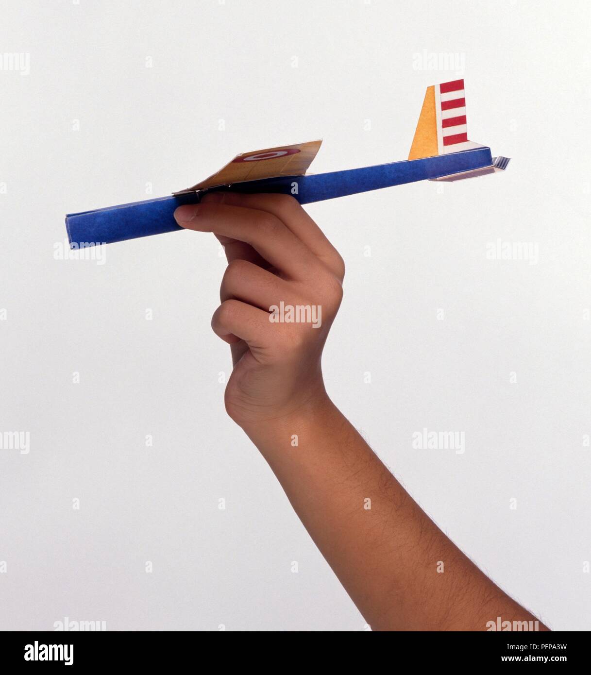 Hand holding model glider Stock Photo - Alamy