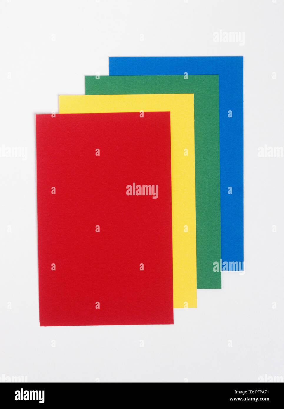 Sheets of coloured paper, blue, green, yellow, red Stock Photo - Alamy