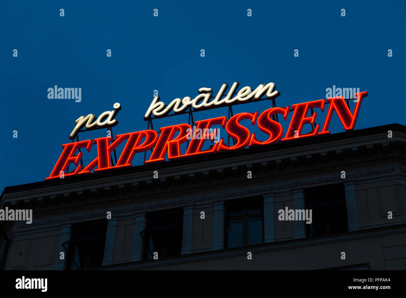 Neon sign of Expressen, Swedish newspaper at night time "Pa kvallen ...